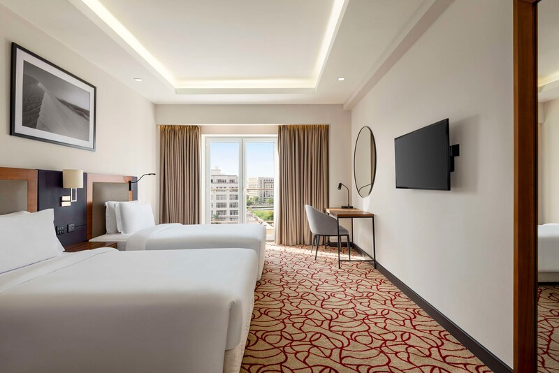 Modern hotel rooms in Muscat city center | Radisson Hotels